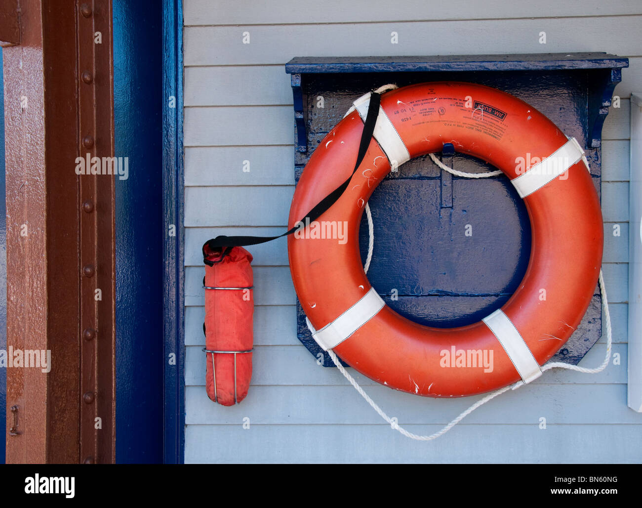 Life saver on wall Stock Photo - Alamy