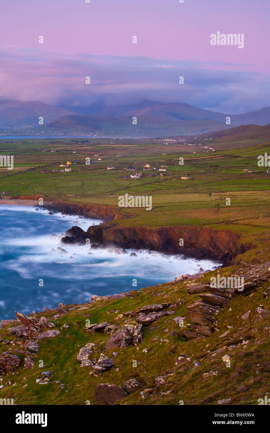 Dramatic coastal landscape illuminated at dusk, Ballyferriter Bay ...