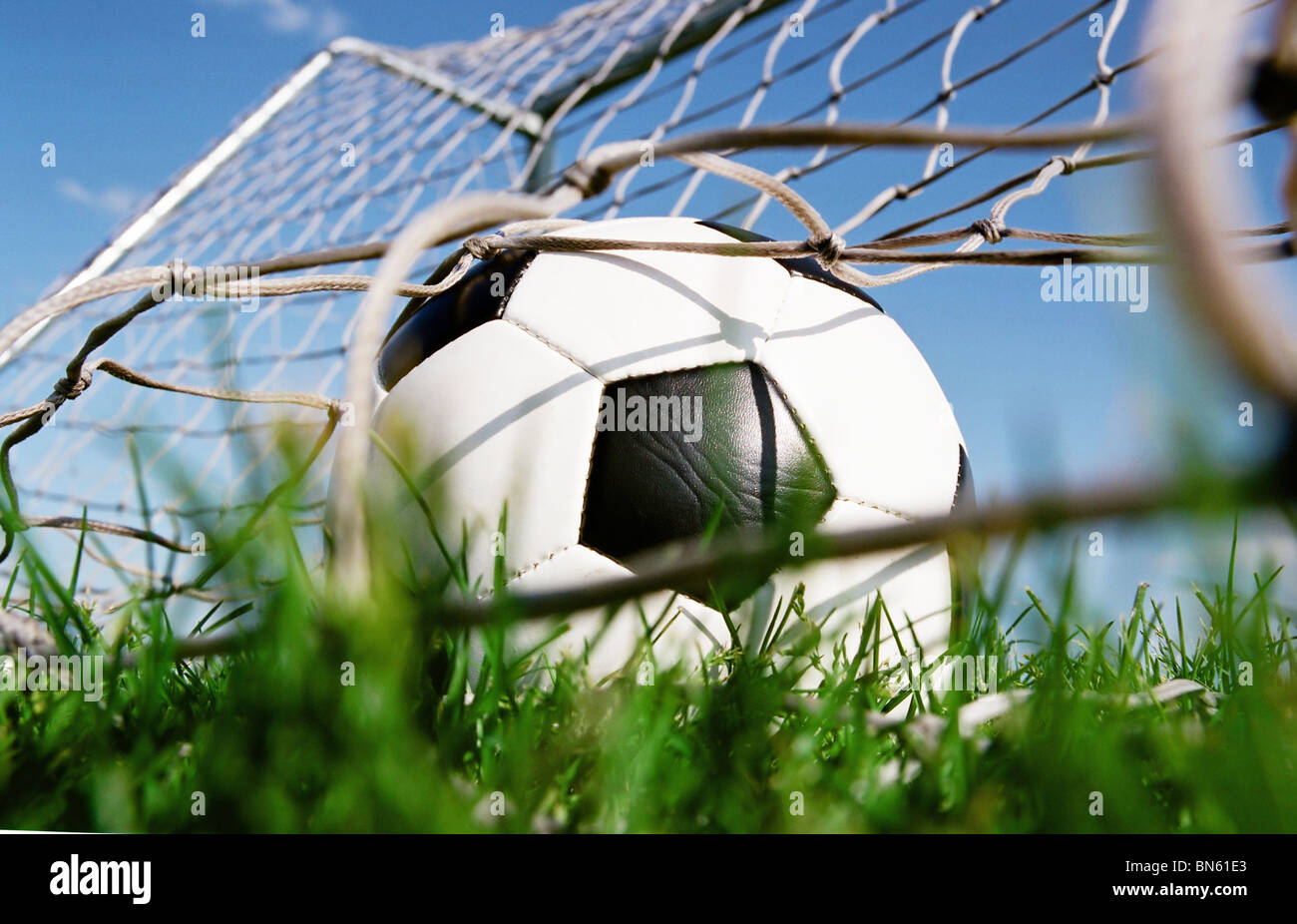 Football in the goal net Stock Photo - Alamy