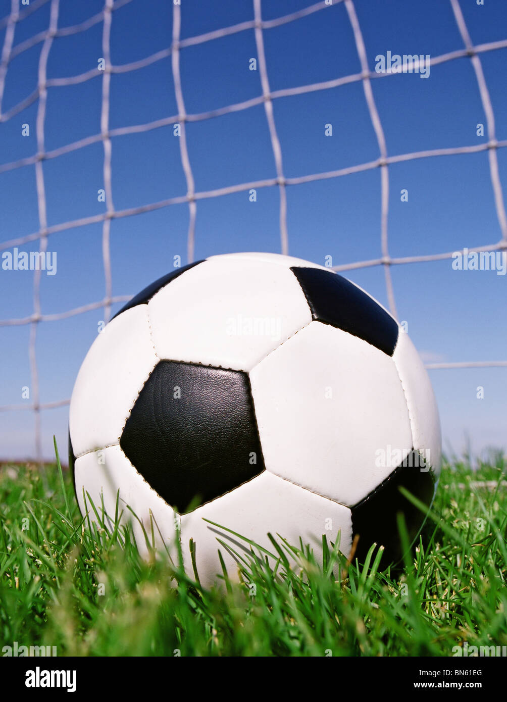 Football in the goal net Stock Photo - Alamy