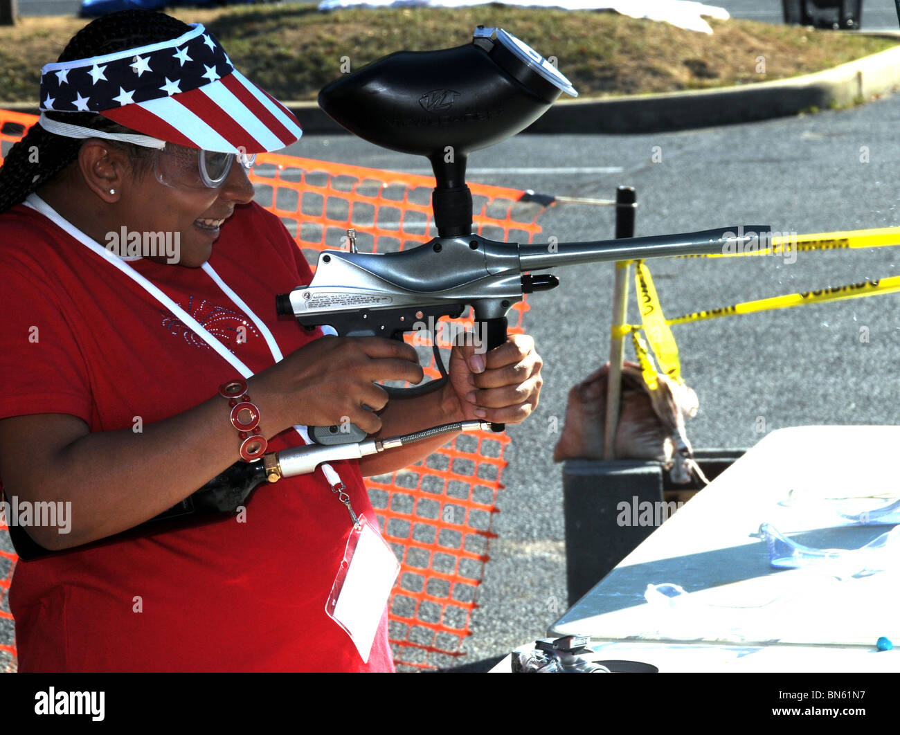 . This woman tries her hand at paint ball target practice.in Lahnam, Md ...