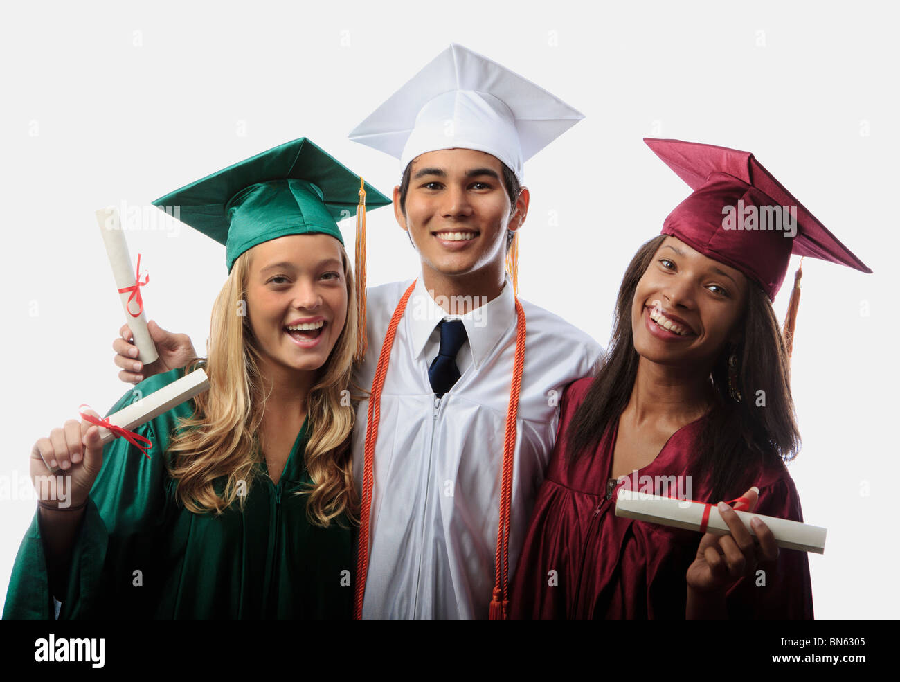 three graduates in cap and gown with diplomas Stock Photo - Alamy