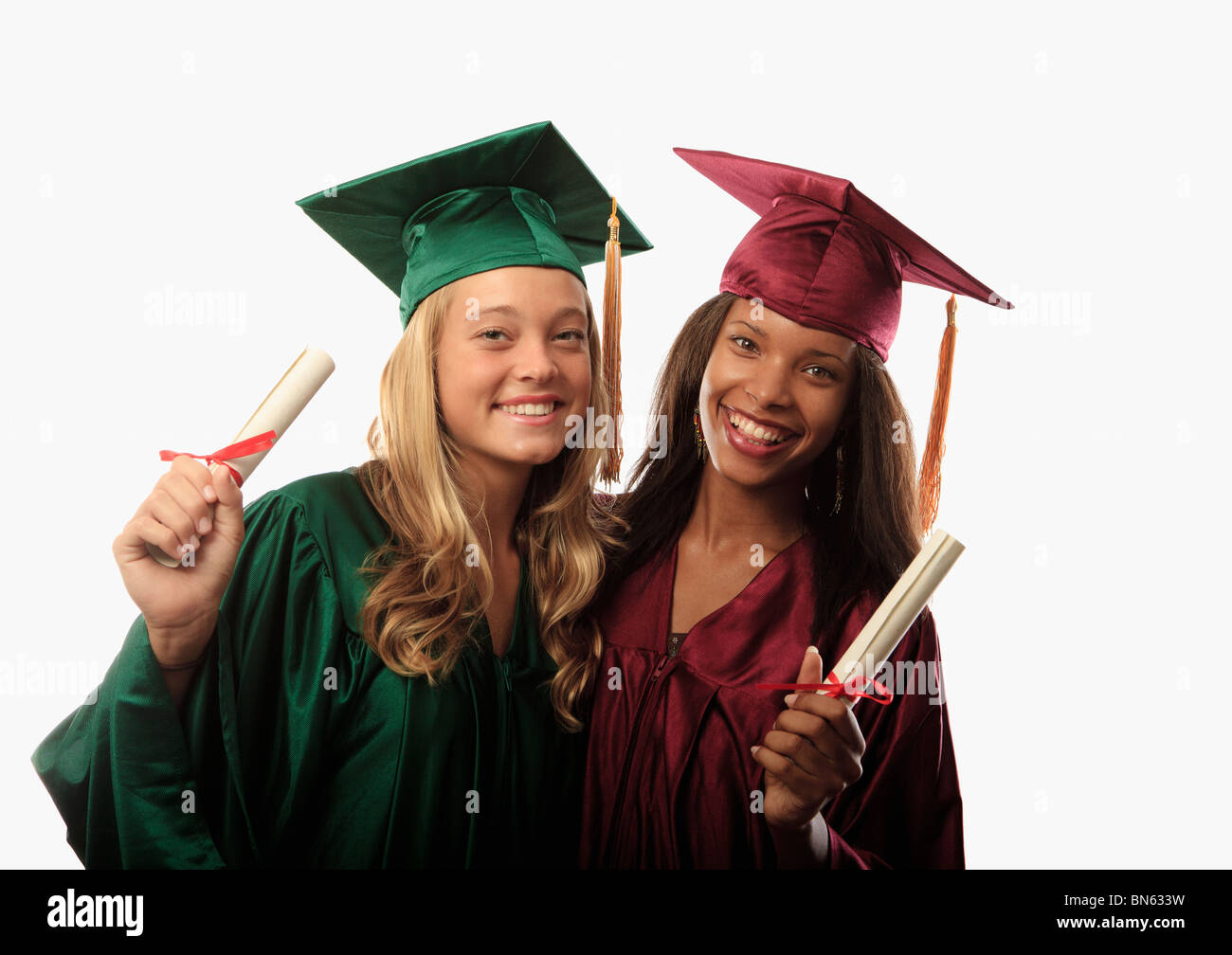 two female graduates in cap and gown with diplomas Stock Photo - Alamy