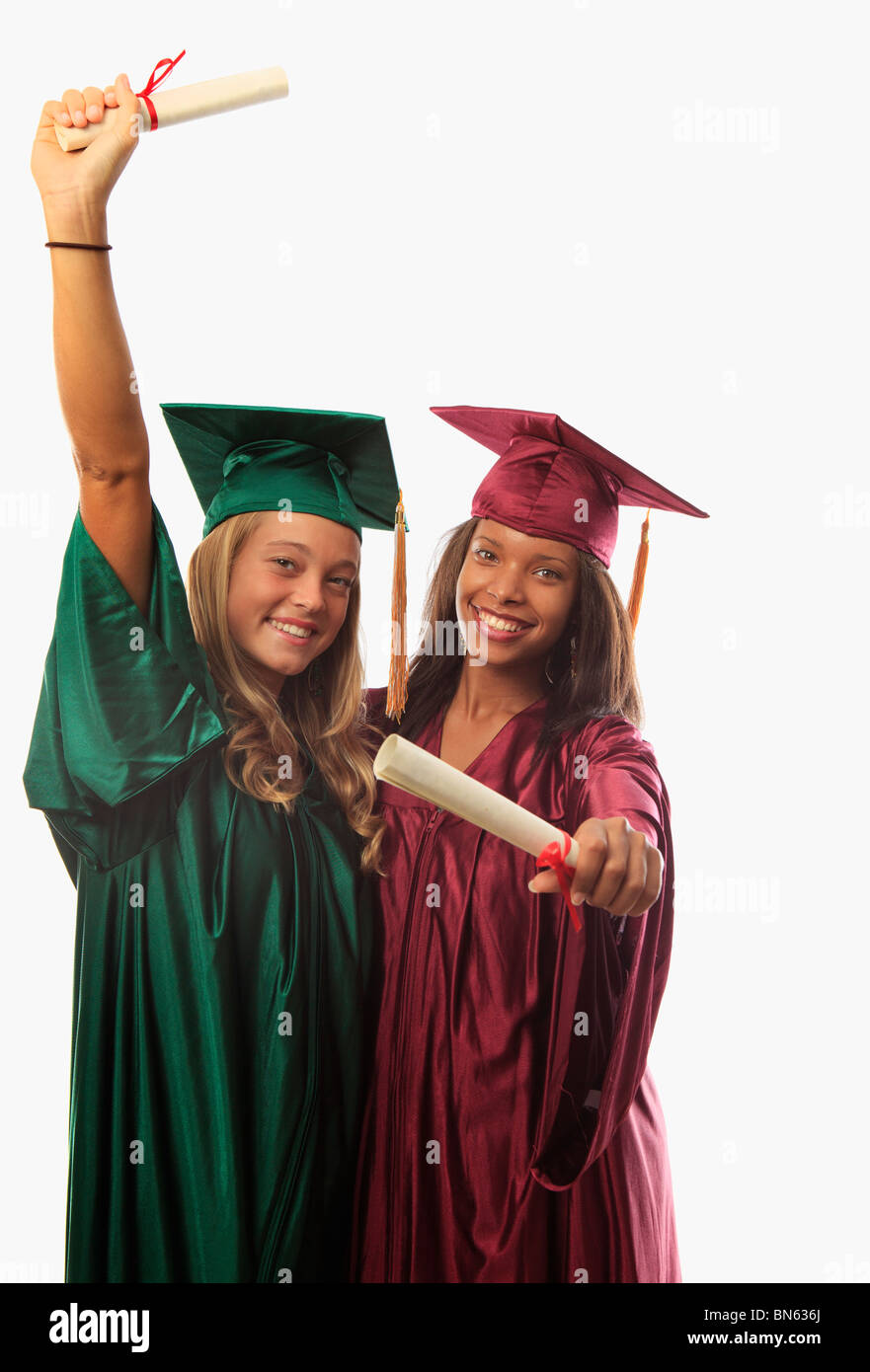 two female graduates in cap and gown with diplomas Stock Photo - Alamy