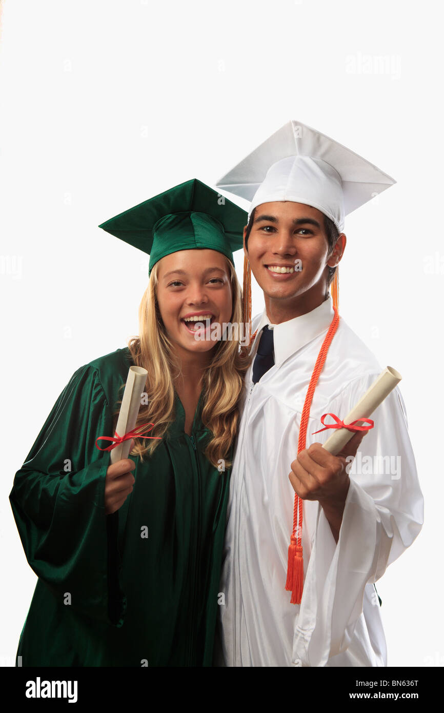 two graduates in cap and gown with diplomas Stock Photo - Alamy