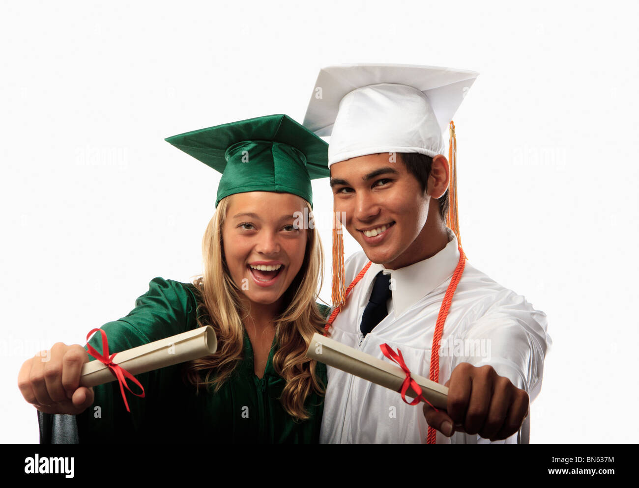 two graduates in cap and gown with diplomas Stock Photo - Alamy