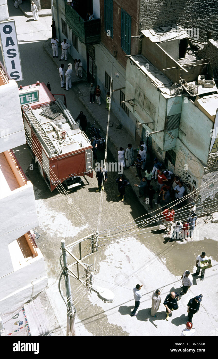Fire engine and crowd in front of the Nubian Oasis Hostel in Luxor ...