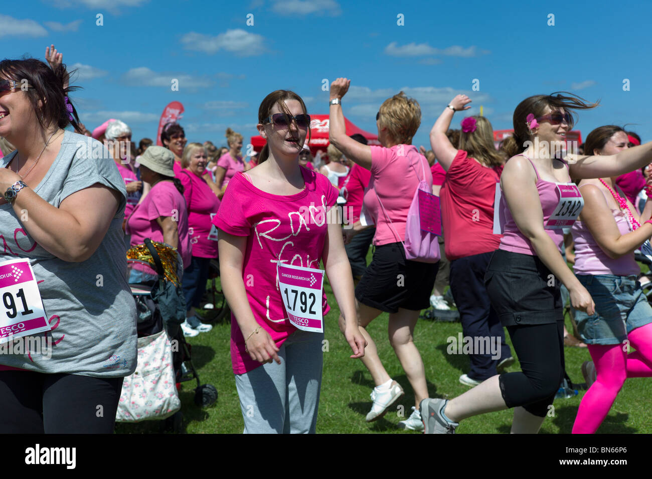 Women and children taking part in the race for life. A Cancer Charity ...