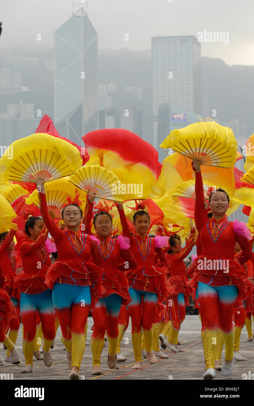 Young Chinese girls in festive outfits dancing during Chinese Lunar New ...