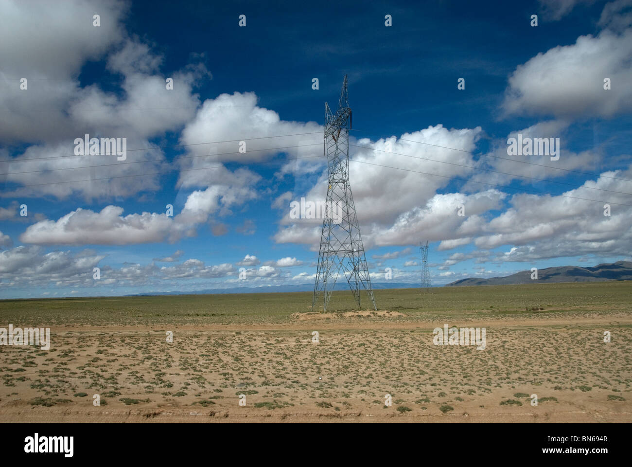Altiplano landscape with pylons and clouds Stock Photo - Alamy
