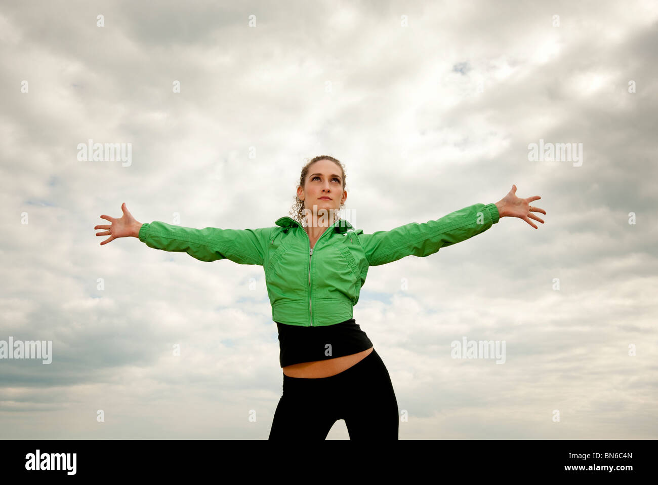woman stretching arms out Stock Photo - Alamy