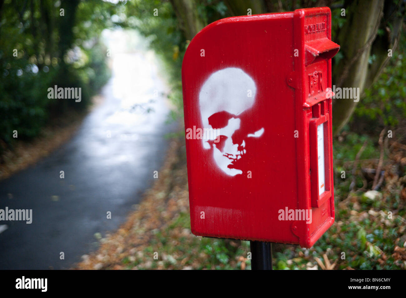 Post box by country road with white skull stenciled on it Stock Photo ...
