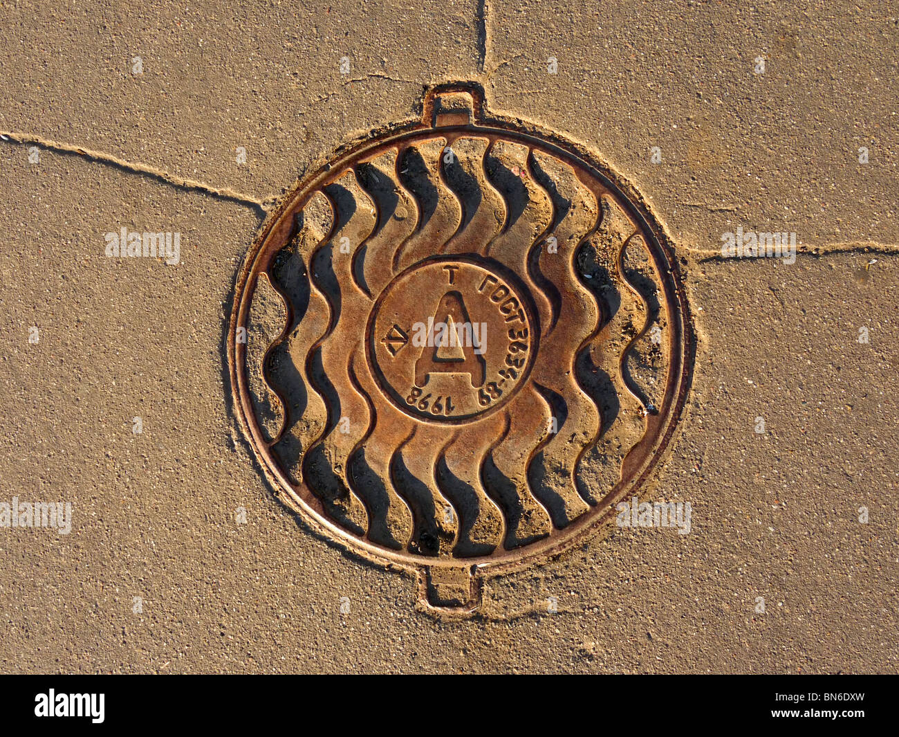 Manhole cover cast iron letters hi-res stock photography and images - Alamy