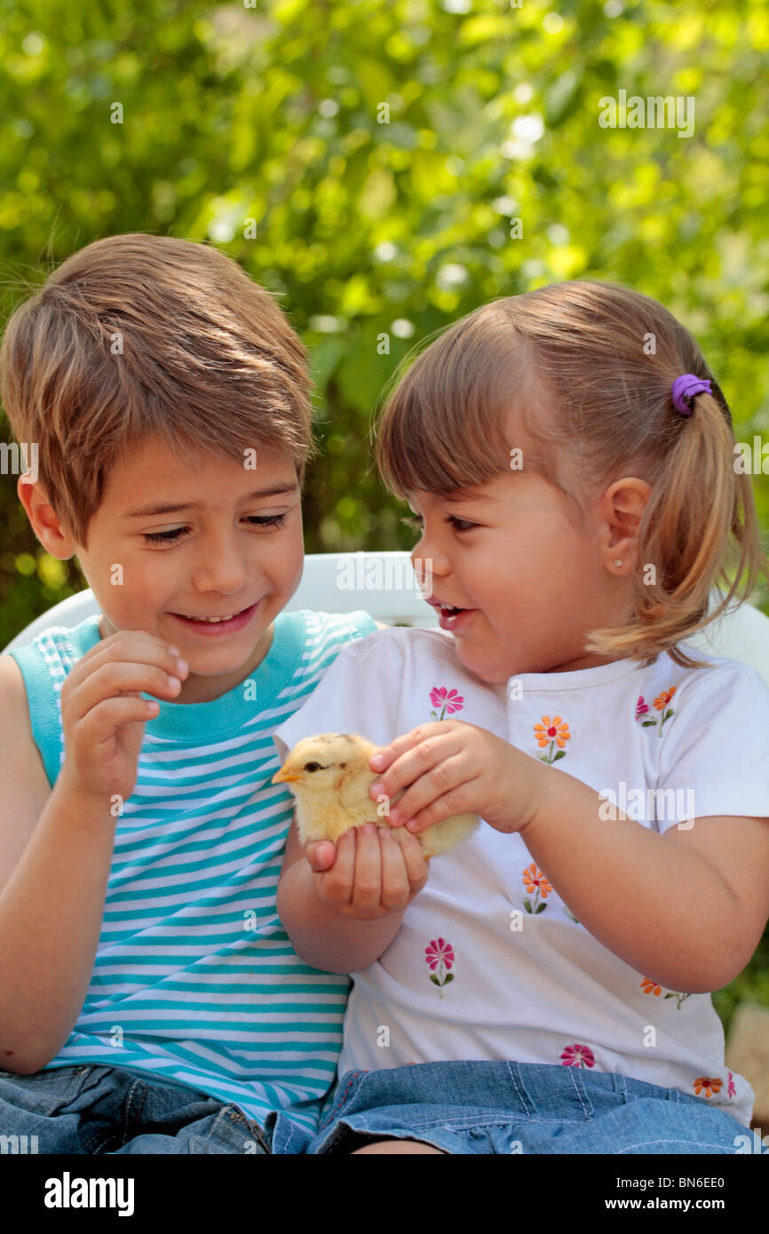 Kids and chick Stock Photo - Alamy