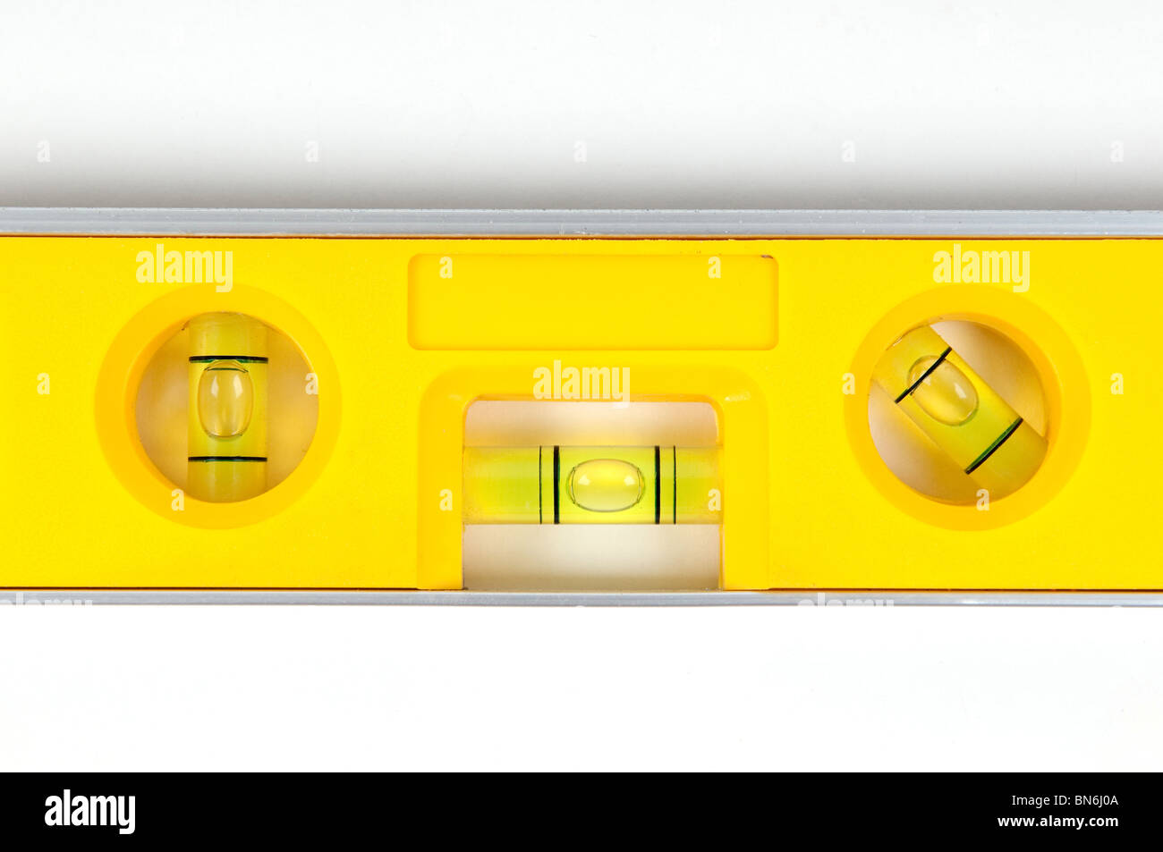 Yellow spirit level isolated on a white background Stock Photo - Alamy