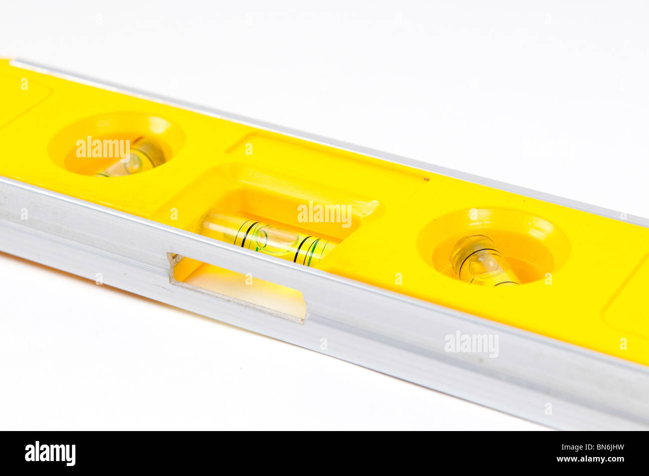 Yellow spirit level isolated on a white background Stock Photo - Alamy