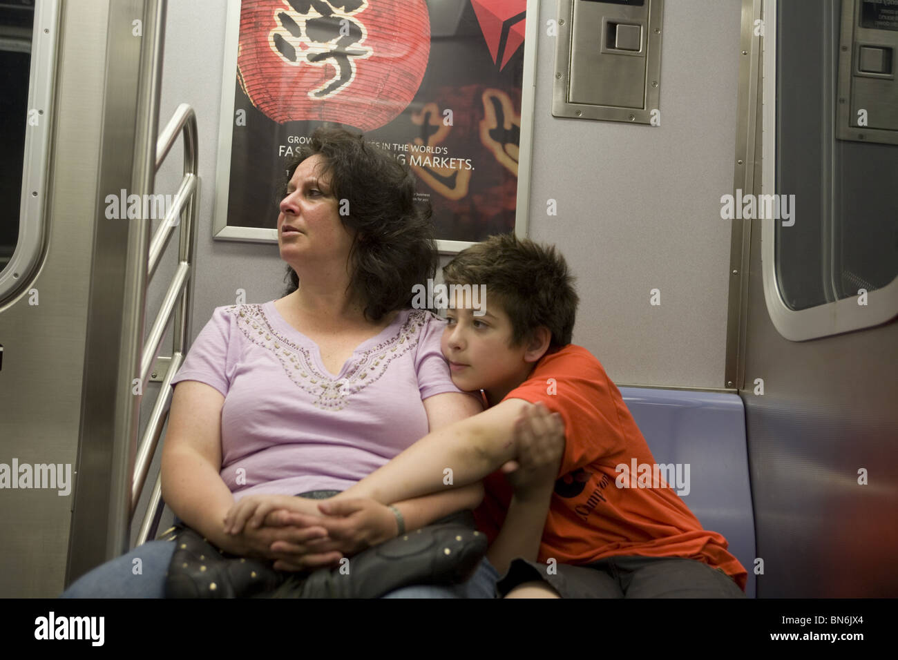 Mother and son ride the subway in New York City Stock Photo - Alamy