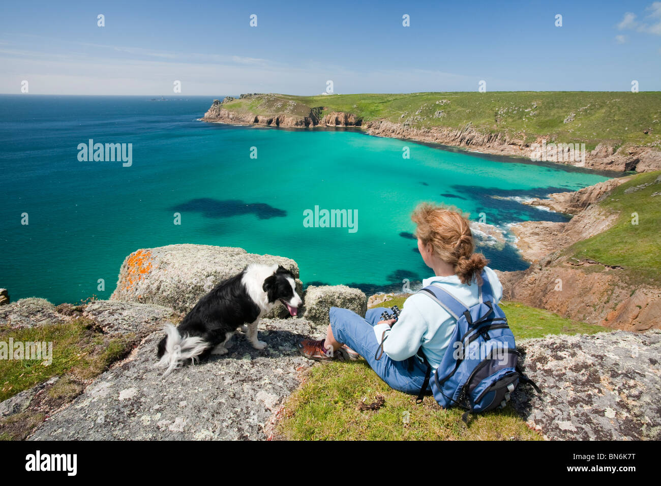 A women enjoying Cornish coastal scenery at Gwennap Head looking ...