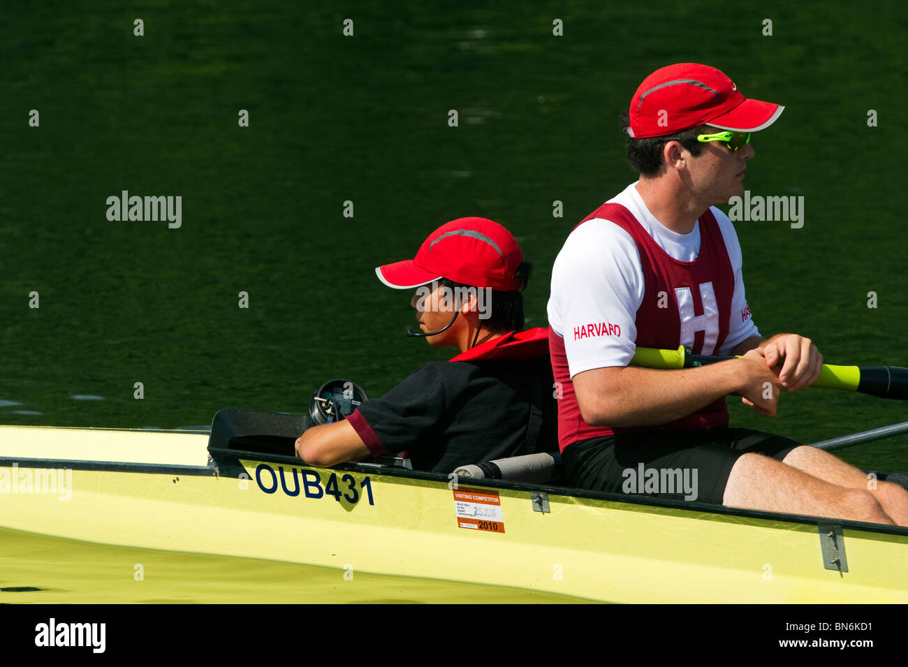 Coxswain (cox for short) and rower relax just before the start of a ...