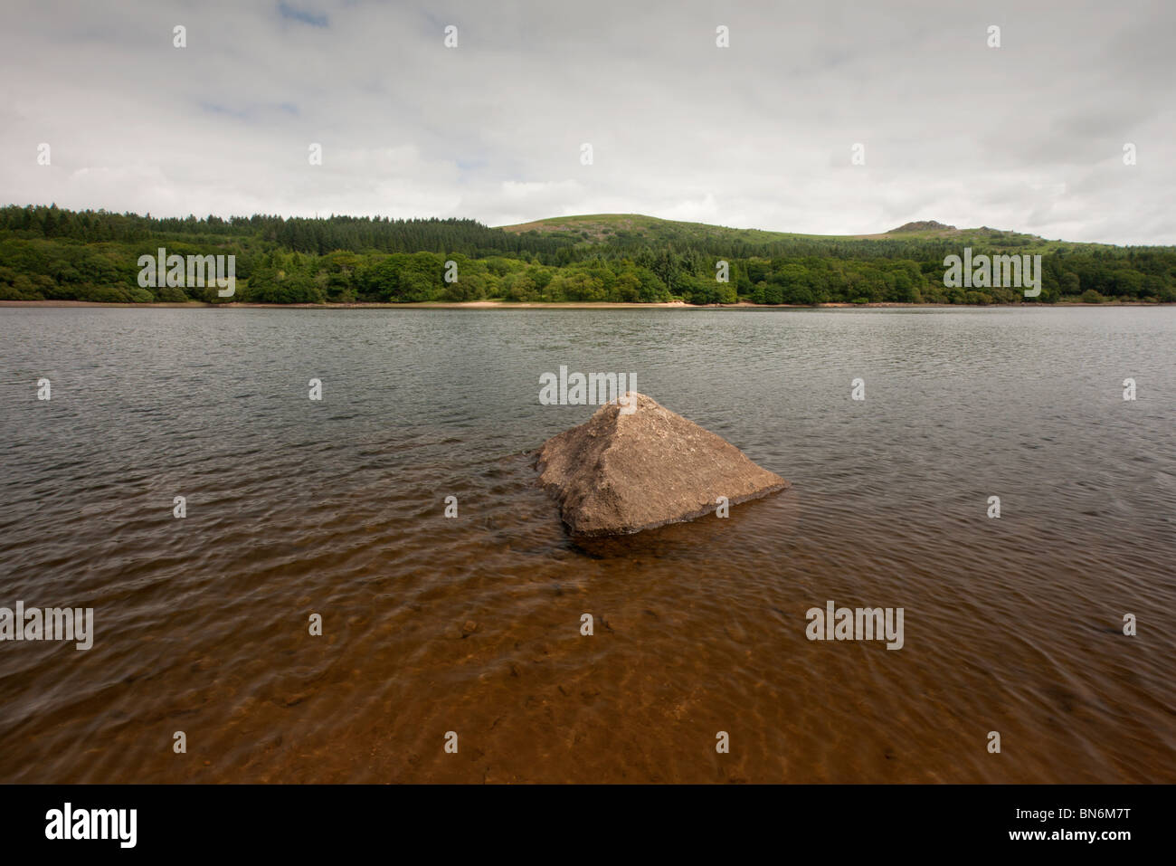 A large pyramid shaped rock emerges from the falling reservoir level ...