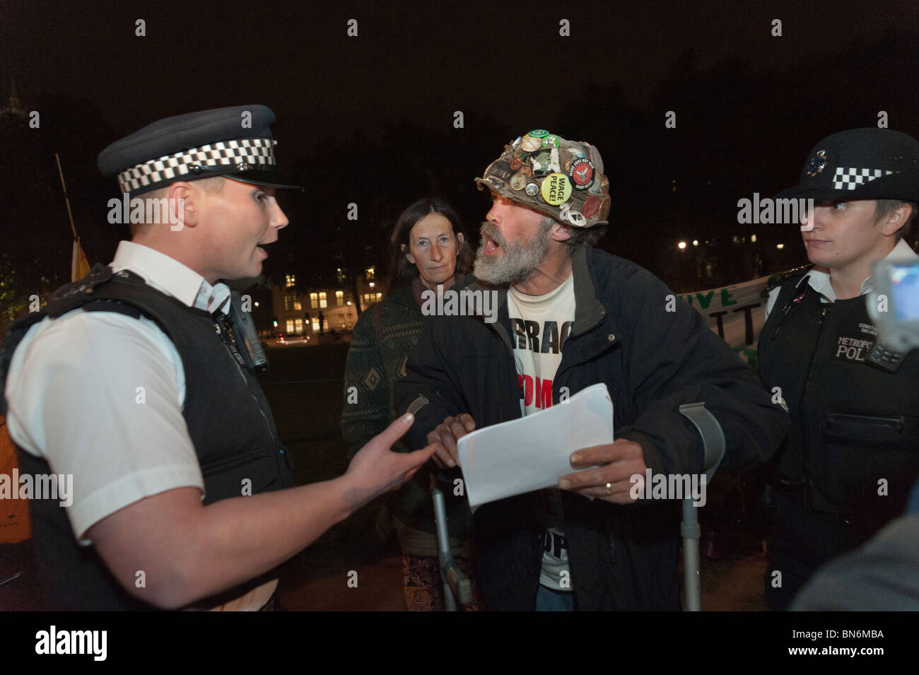 Police officers arrest peace campaigner Brian Haw in Parliament Square ...