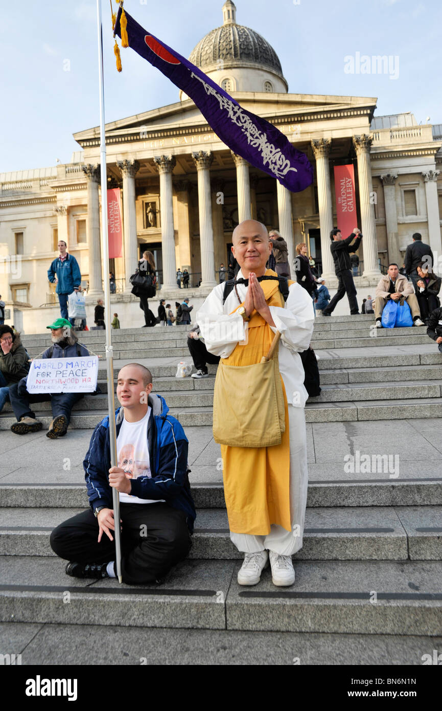 World March For Peace and Nonviolence - Buddhist monk raises hands in ...