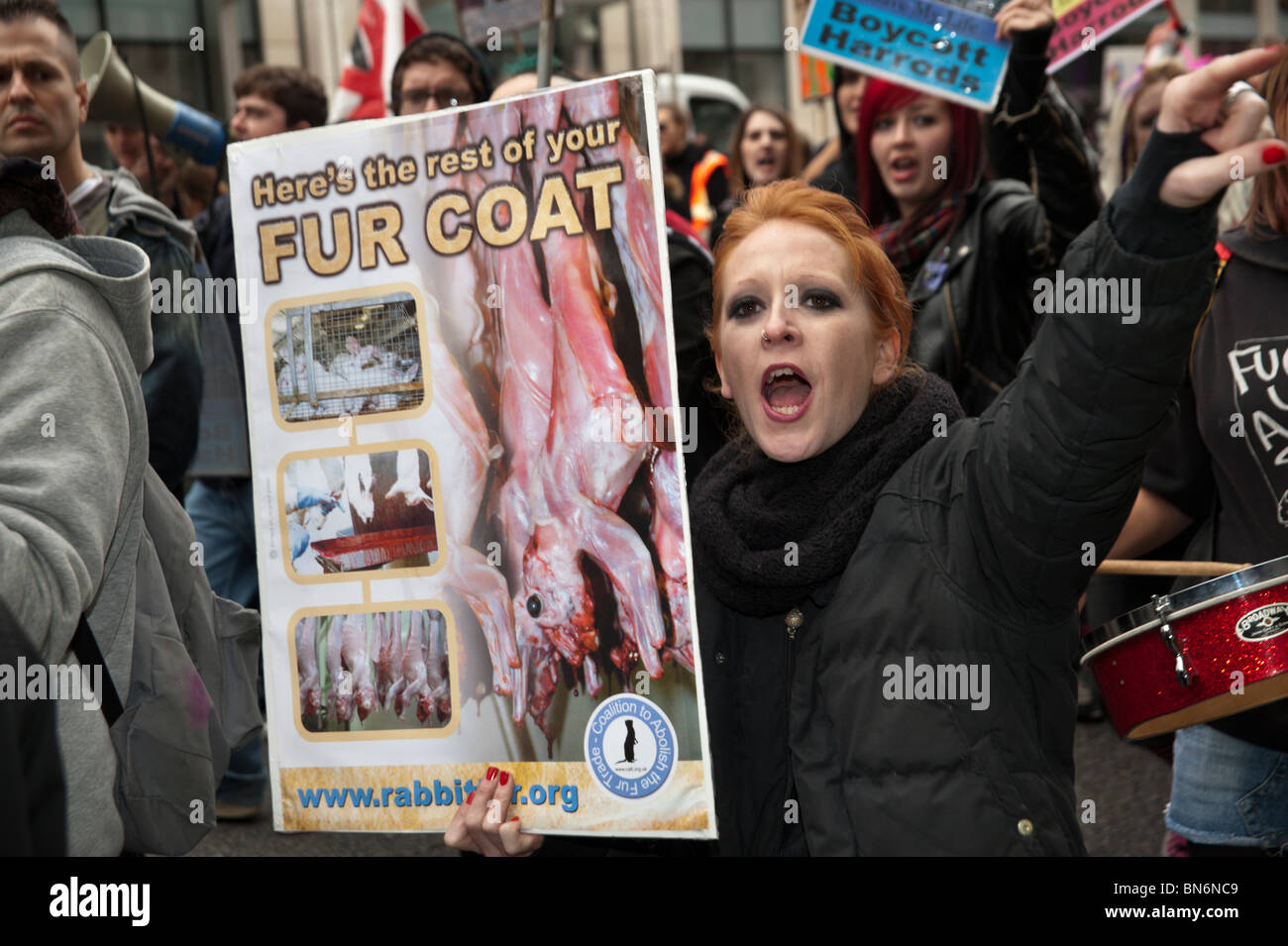 Woman in crowd shouts and holds up anti-fur poster in National Anti-Fur ...