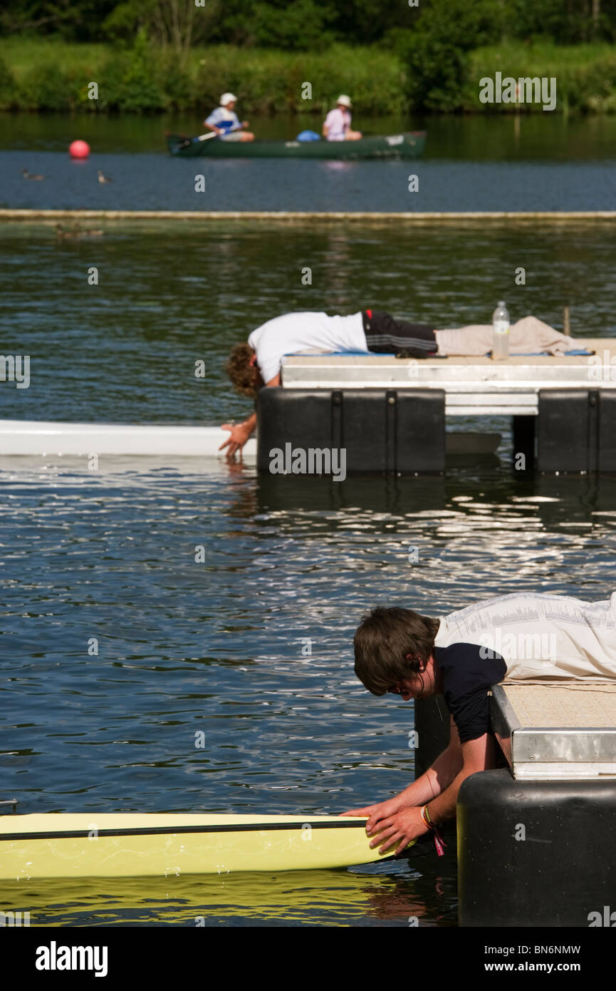race starters on the start line on the River Thames restraining ...