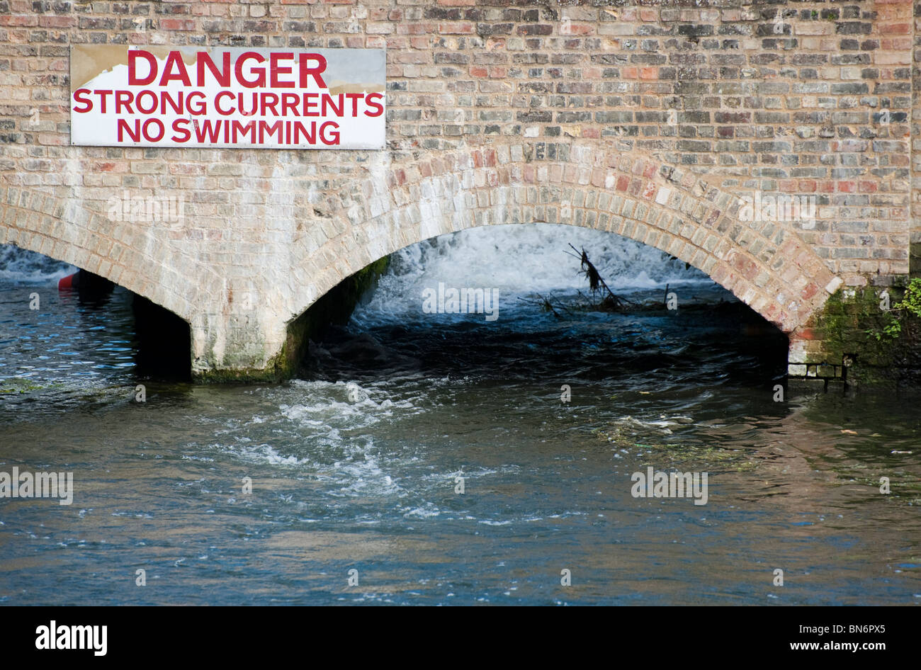 Bridge at the river Cam Cambridge UK, with warning signs of dangers of ...