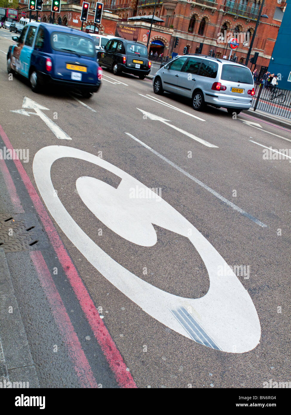 Congestion Charge symbol in road near St Pancras station in north ...