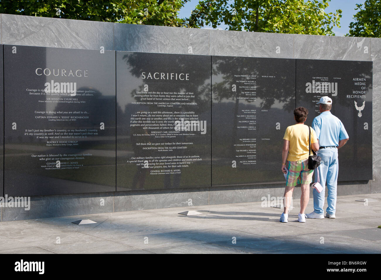 Couple reading Medal of Honor inscriptions on the wall at the United ...