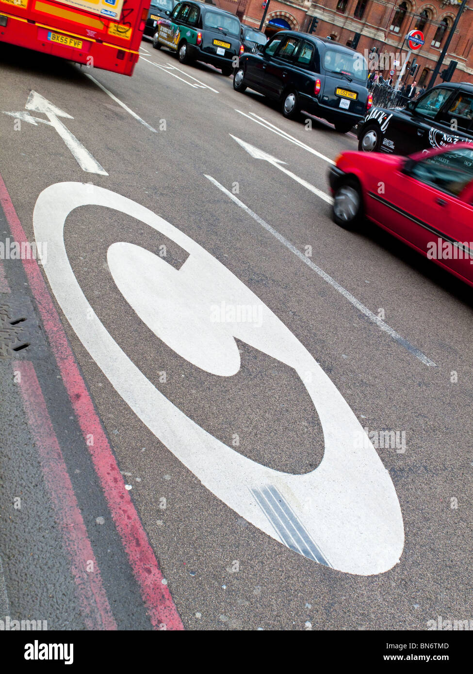 Congestion Charge symbol in road near St Pancras station in north ...