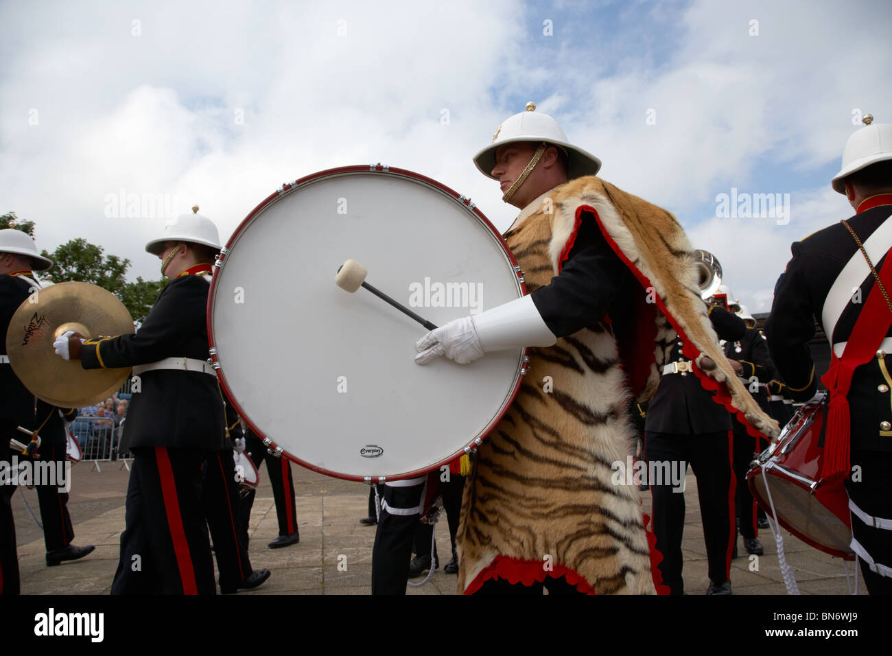 bass drummer wearing tiger skin of the band of HM Royal Marines ...
