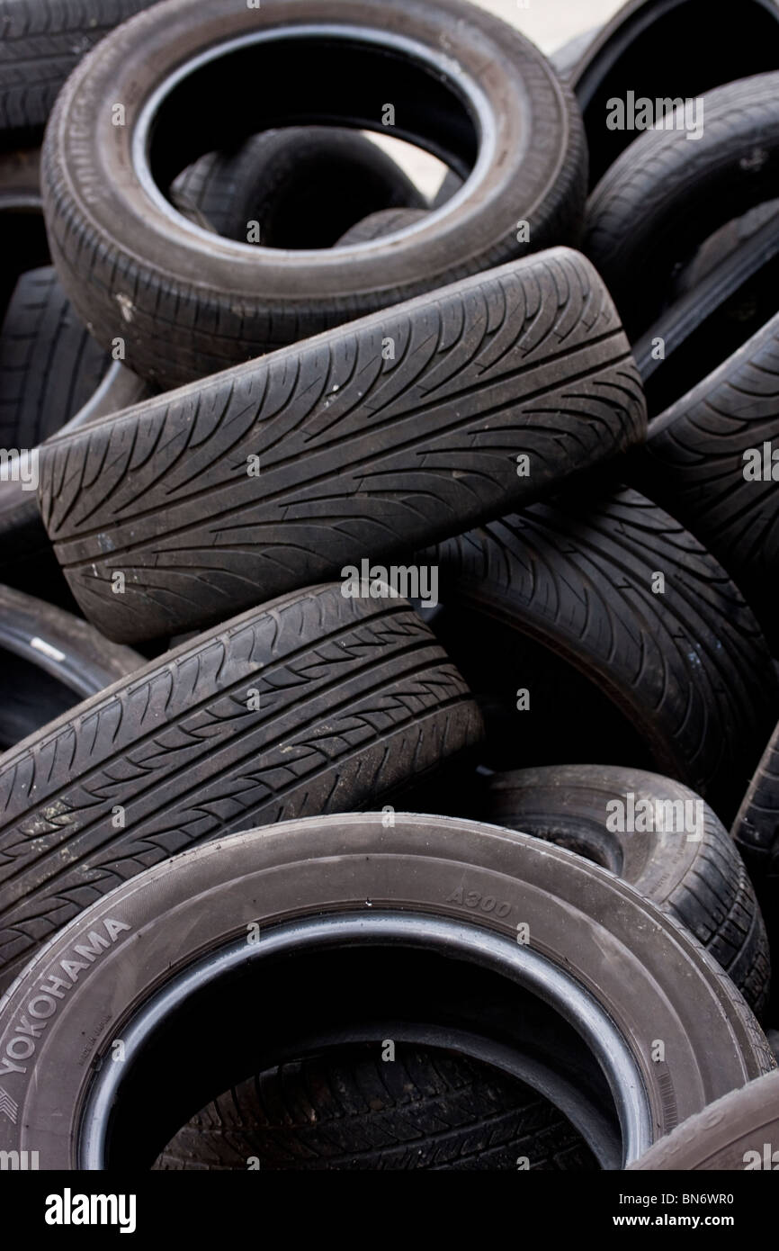 Pile of used car tyres Stock Photo - Alamy