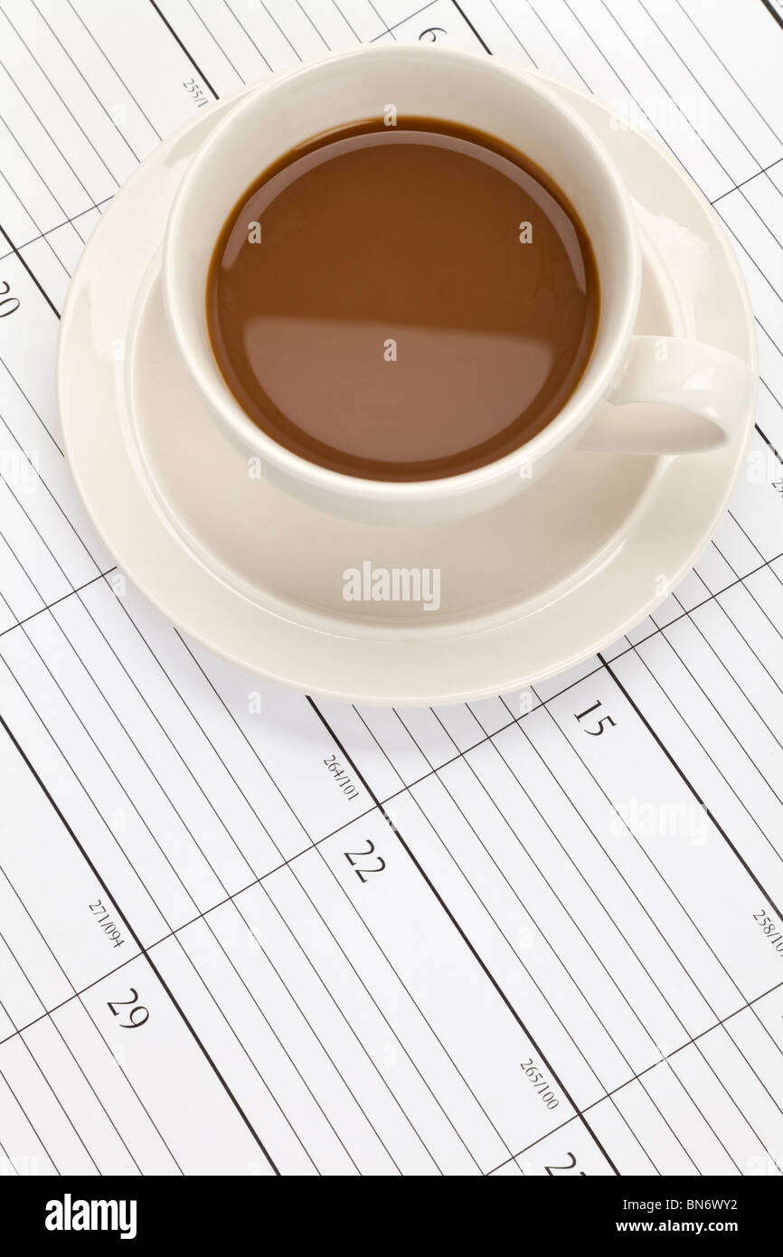Coffee cup and Calendar close up Stock Photo - Alamy