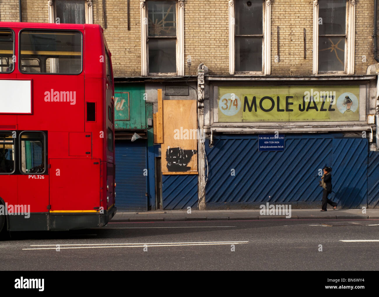 Run down and boarded up shops and offices in King's Cross north London ...