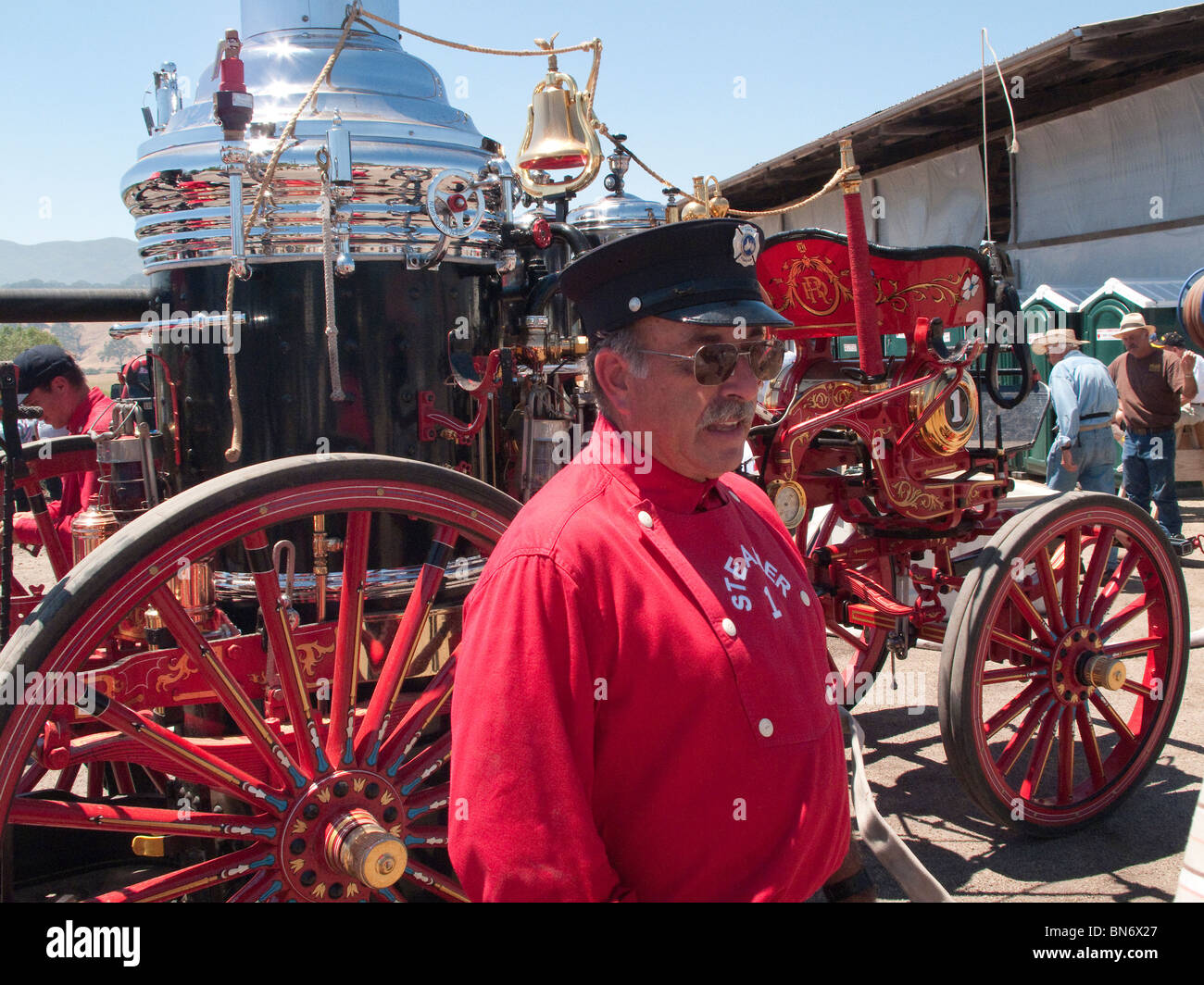 Old time fireman with antique horse drawn steam fire truck, Santa ...