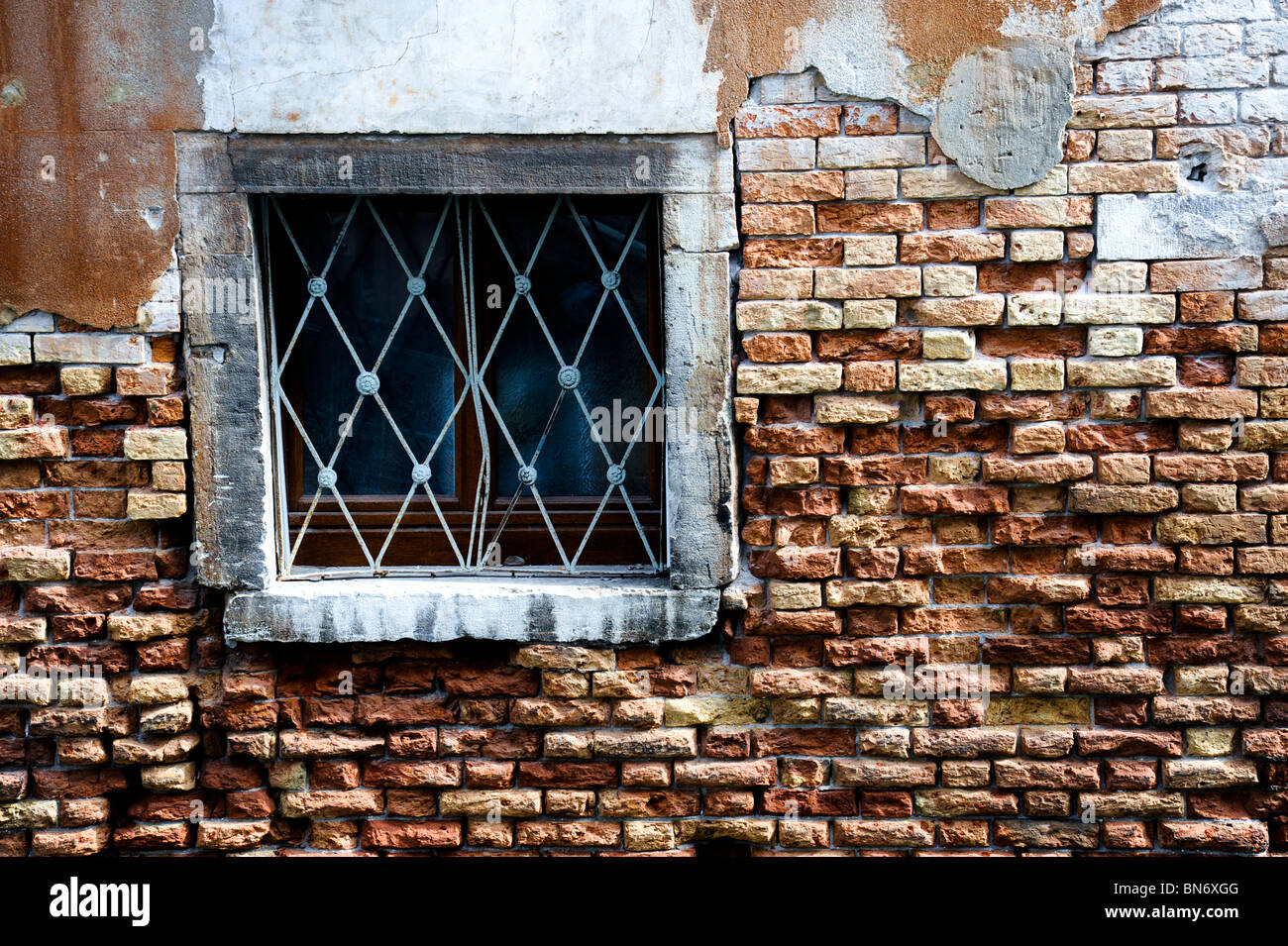 Details of old wall and window in Venice, side lit showing textures ...