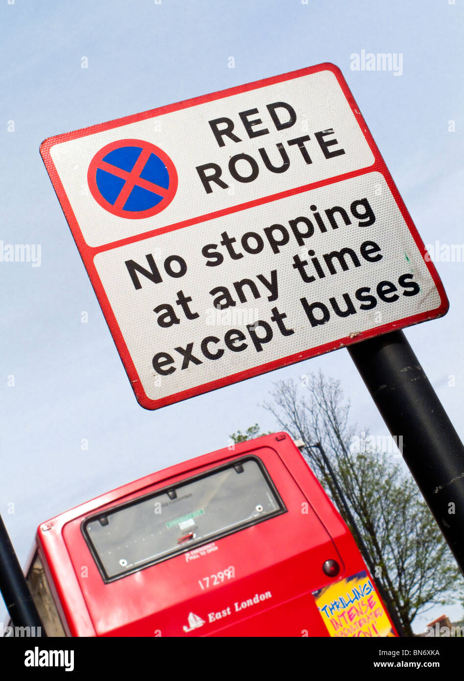 Red Route sign and red double decker bus in London England UK designed ...