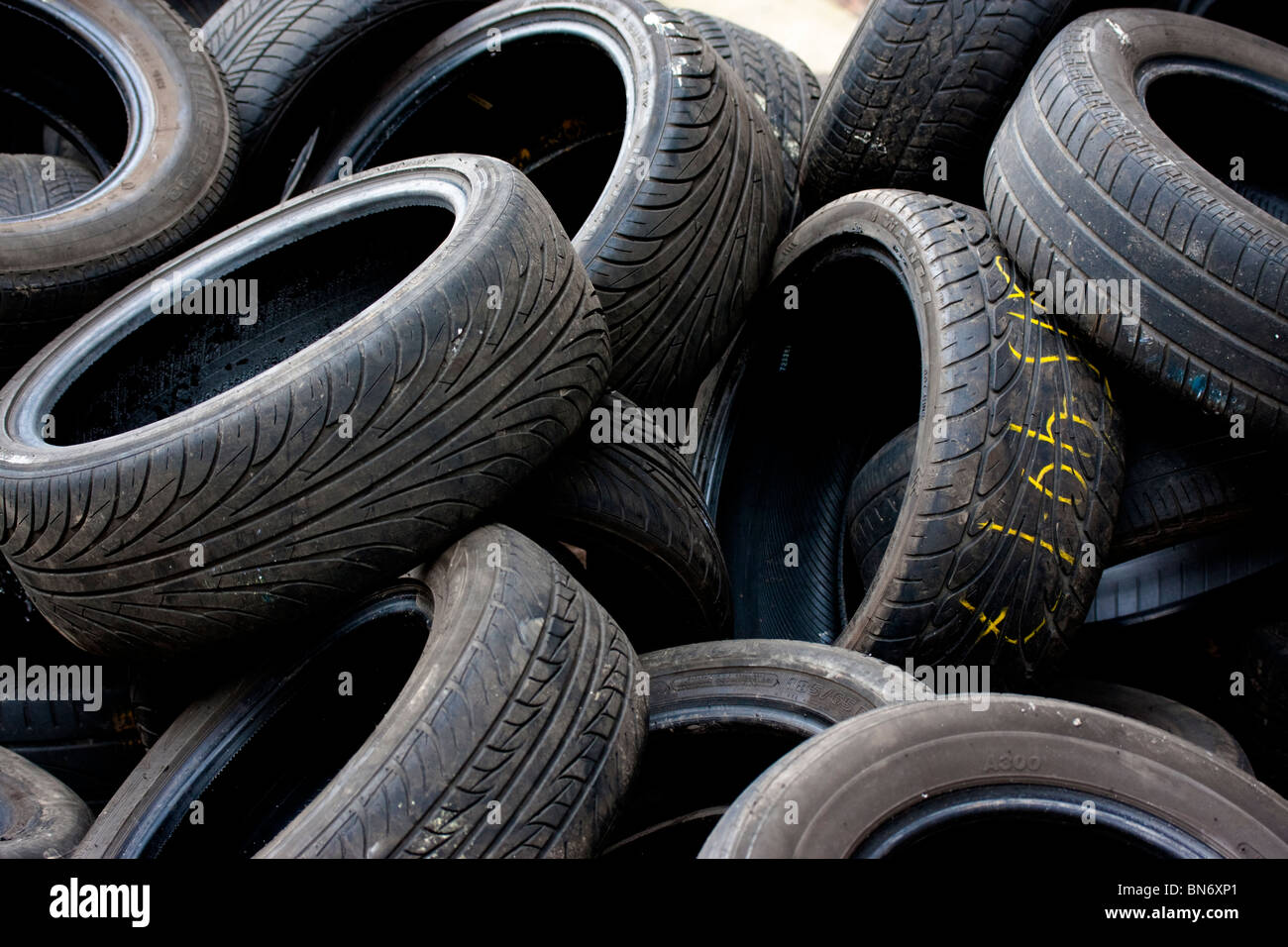 Pile of used car tyres Stock Photo - Alamy