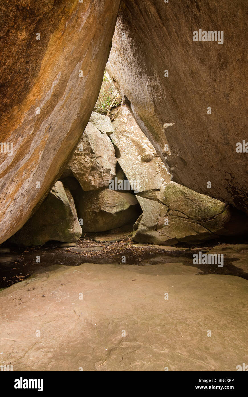 Low angle of sandstone rock with triangular formation and sunlight ...