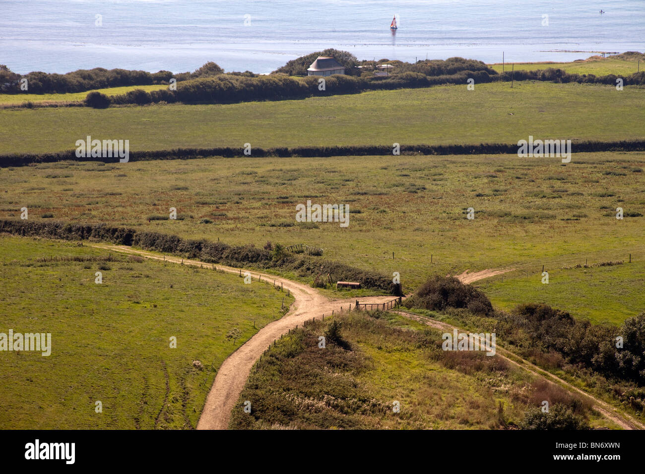 view over countryside and the coastline at ringstead bay dorset - route ...
