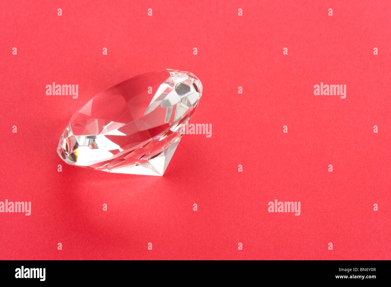 Diamond close up shot with red background Stock Photo - Alamy