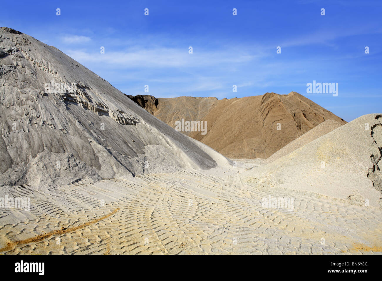 sand quarry mounds of varied construction sands Stock Photo - Alamy