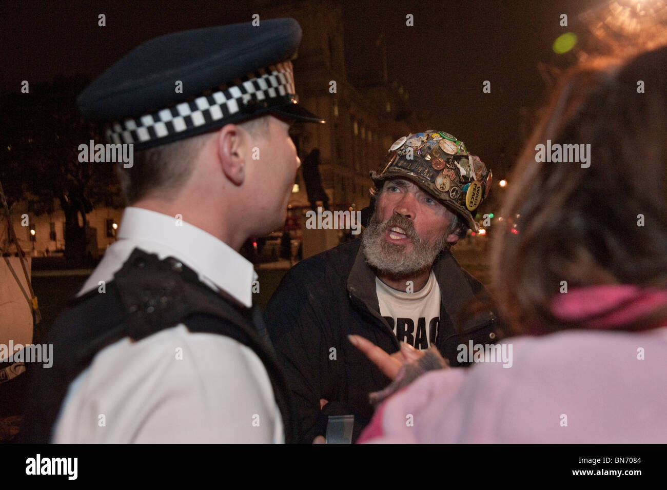 Police officers arrest peace campaigner Brian Haw in Parliament Square ...