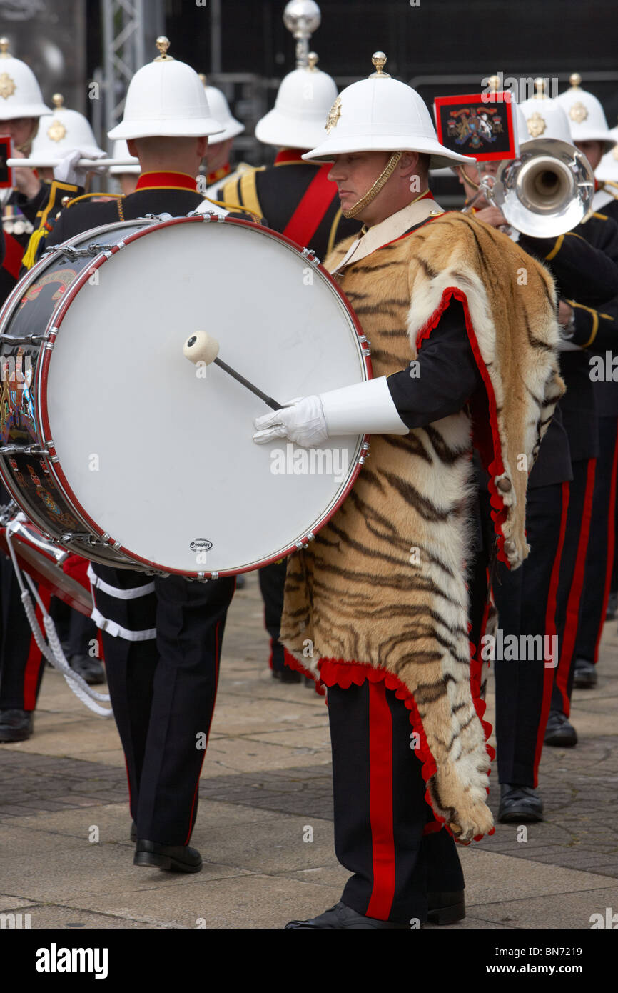 bass drummer wearing tiger skin of the band of HM Royal Marines ...