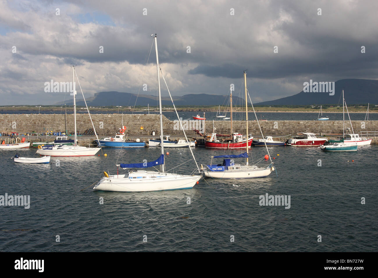 A sunny evening in Mullaghmore with sunshine across Mullaghmore Harbour ...