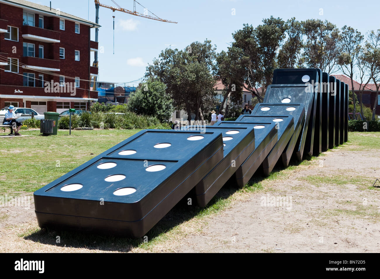 A line of dominos form a sculpture at the Sculpture by the sea event in ...