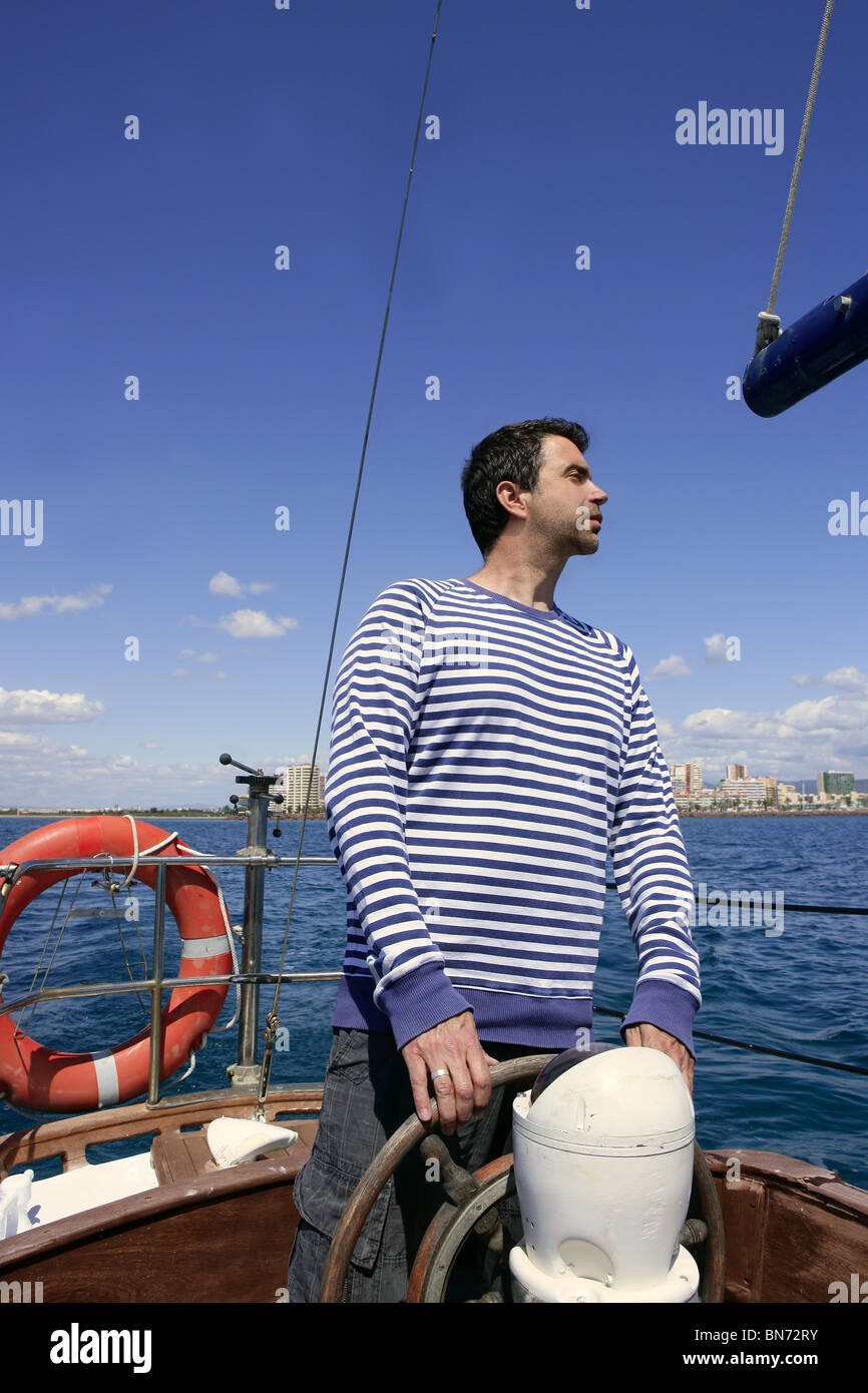 blue sailor man sailing vintage wooden sailboat mediterranean sea Stock ...