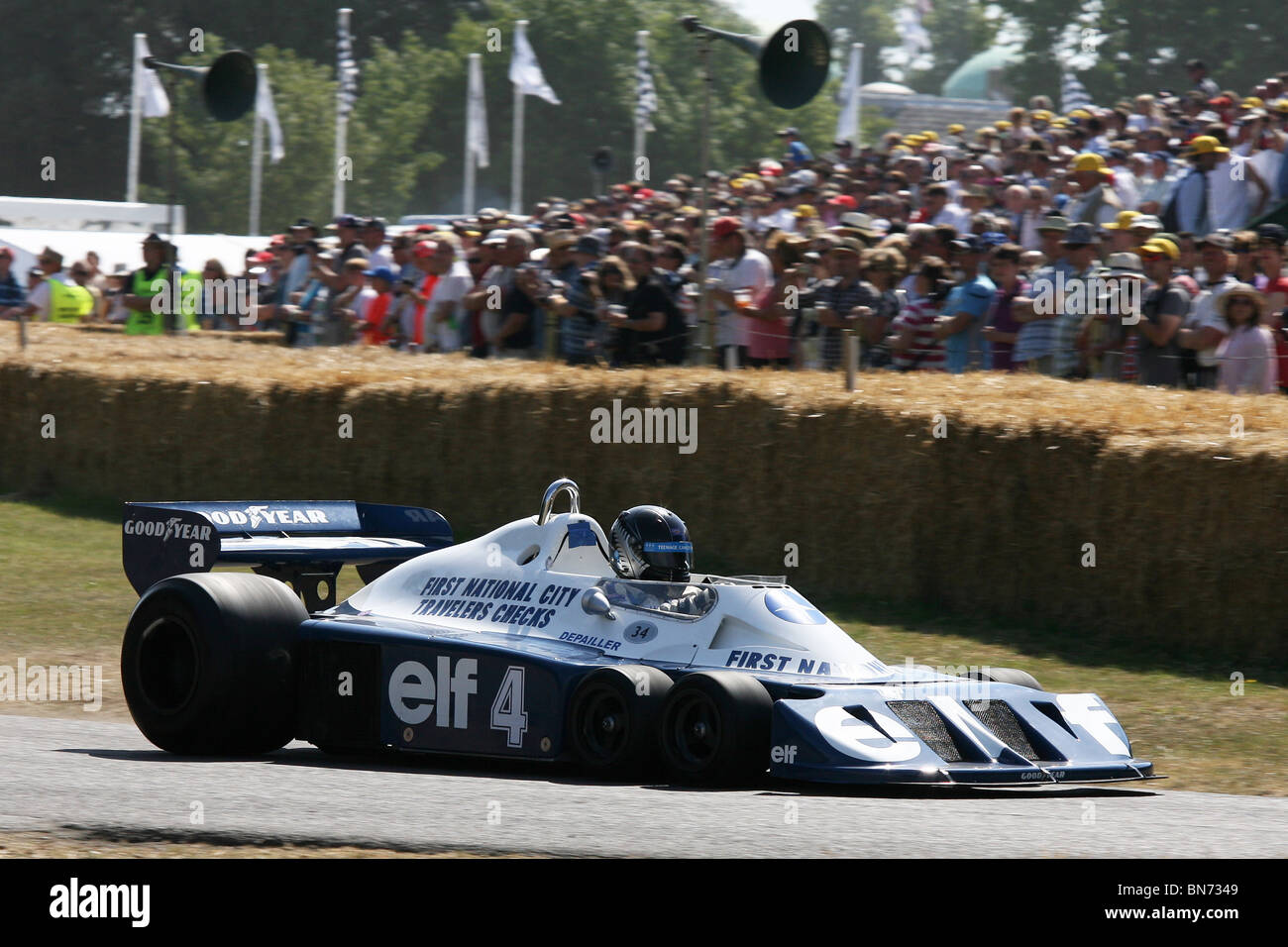 The six wheeled Tyrrell F1 car speeds up the hill at the 2010 Goodwood ...